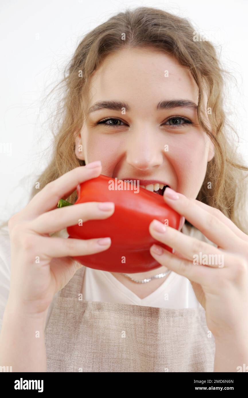 funny cheerful teen girl young woman biting red pepper healthy eating ...