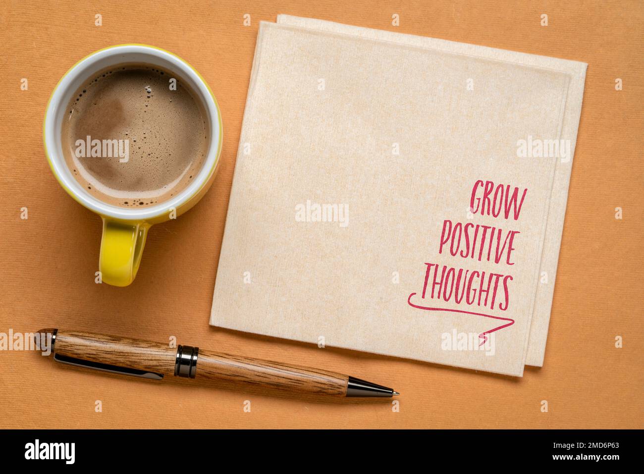 Grow positive thoughts - inspirational note on a napkin with a copy ...