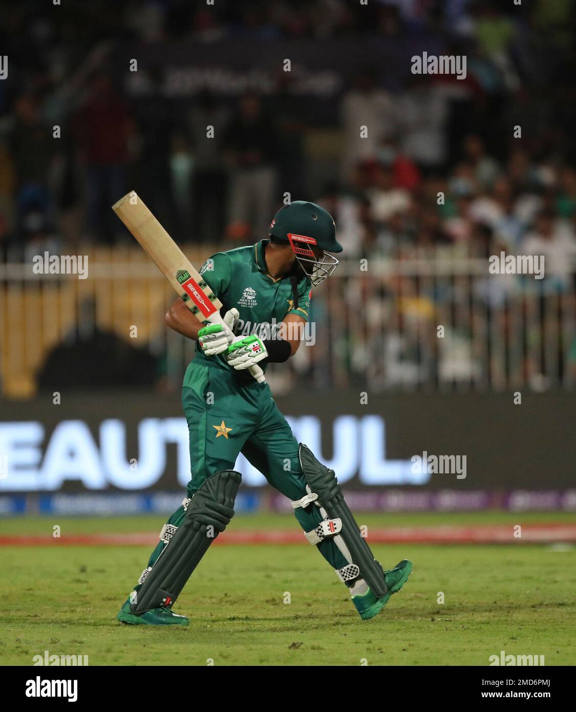 Pakistan's captain Babar Azam reacts as he leaves the field after being ...
