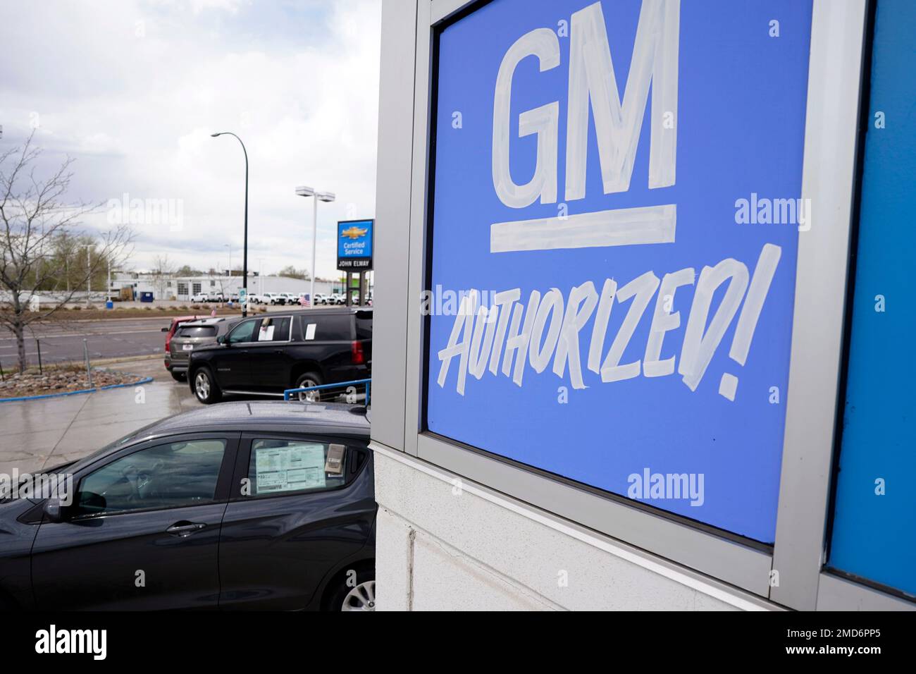 FILE- In this May 2, 2021, file photo, a General Motors sign hangs on ...