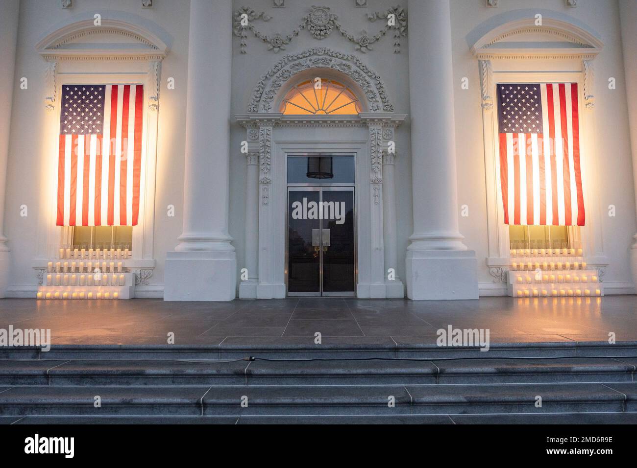 Reportage: Flags are draped on the North Portico of the White House ...