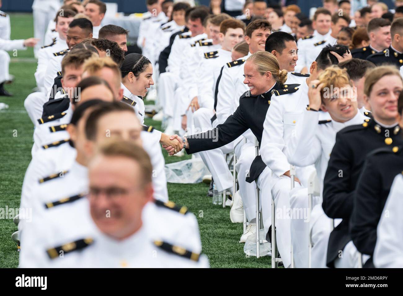 Reportage: Midshipmen congratulate one another during the U.S. Naval ...