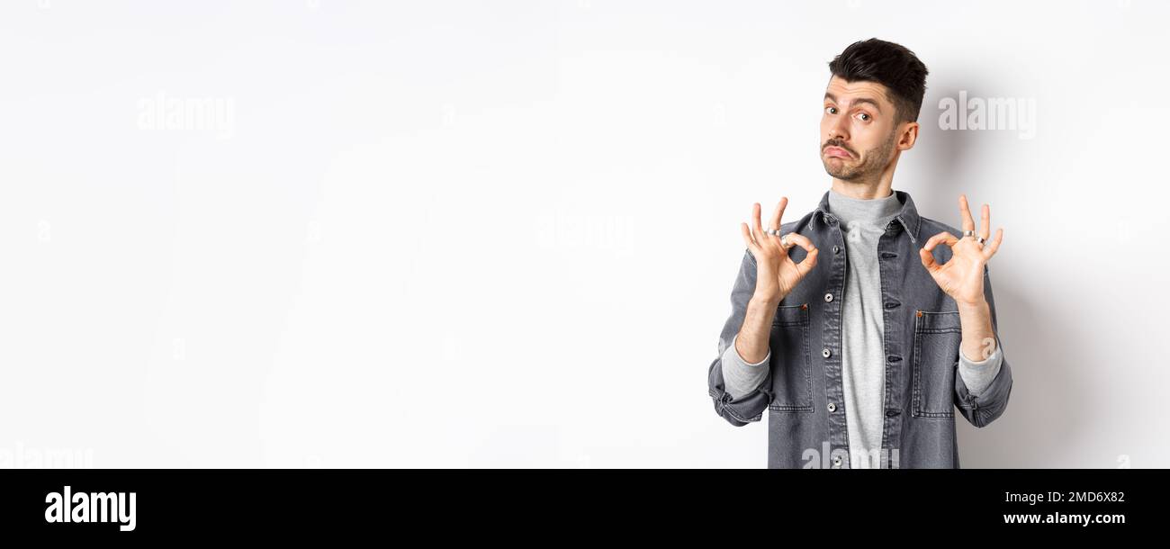 Not bad. Impressed handsome guy nod in approval, showing okay signs to ...