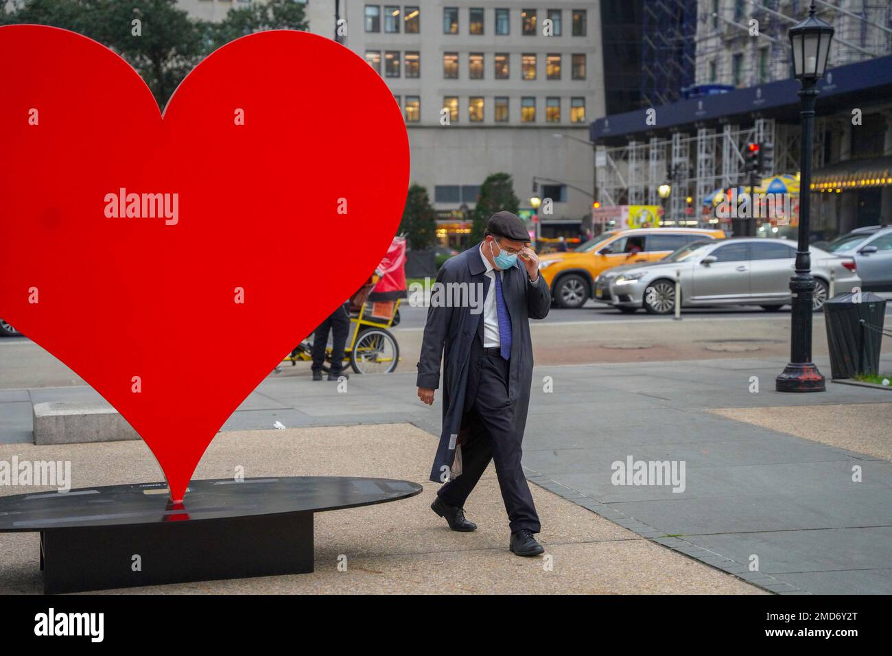 A man walks past "The Hero Monument" sculpture made by Italian sculptor ...