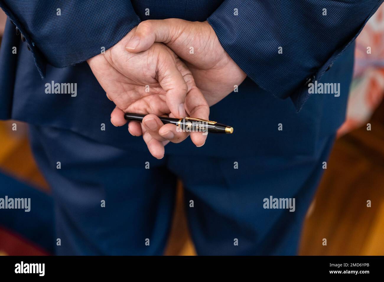 Reportage: U.S. Rep. Mark Takano, D—Calif., holds a pen that President ...