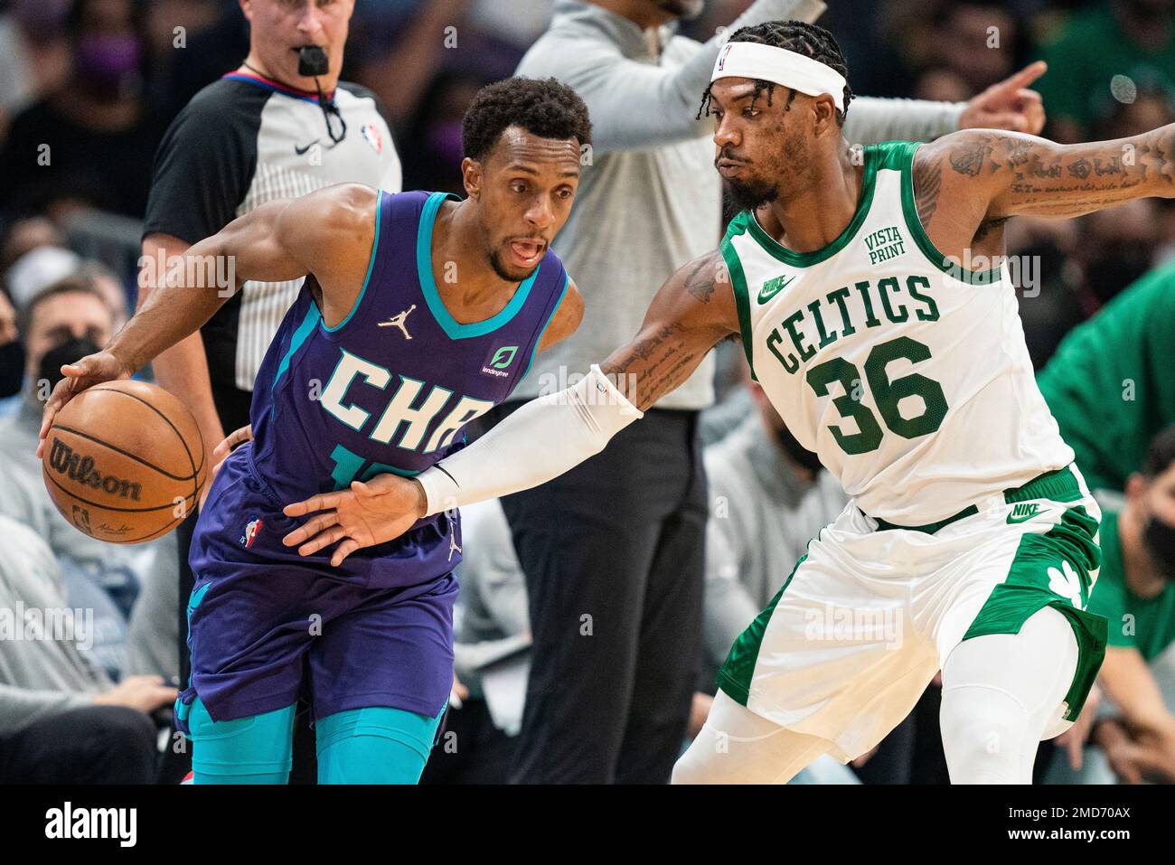 Charlotte Hornets guard Ish Smith, left, is guarded by Boston Celtics ...