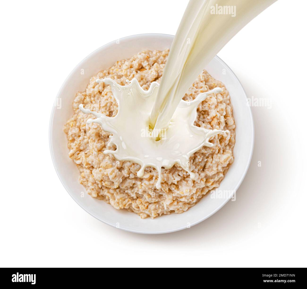 Oatmeal with milk splash isolated on white background, top view Stock ...