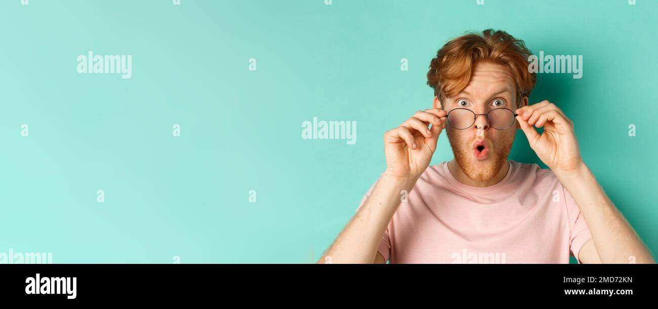 Surprised Young Man With Red Hair Checking Out Something Cool Take