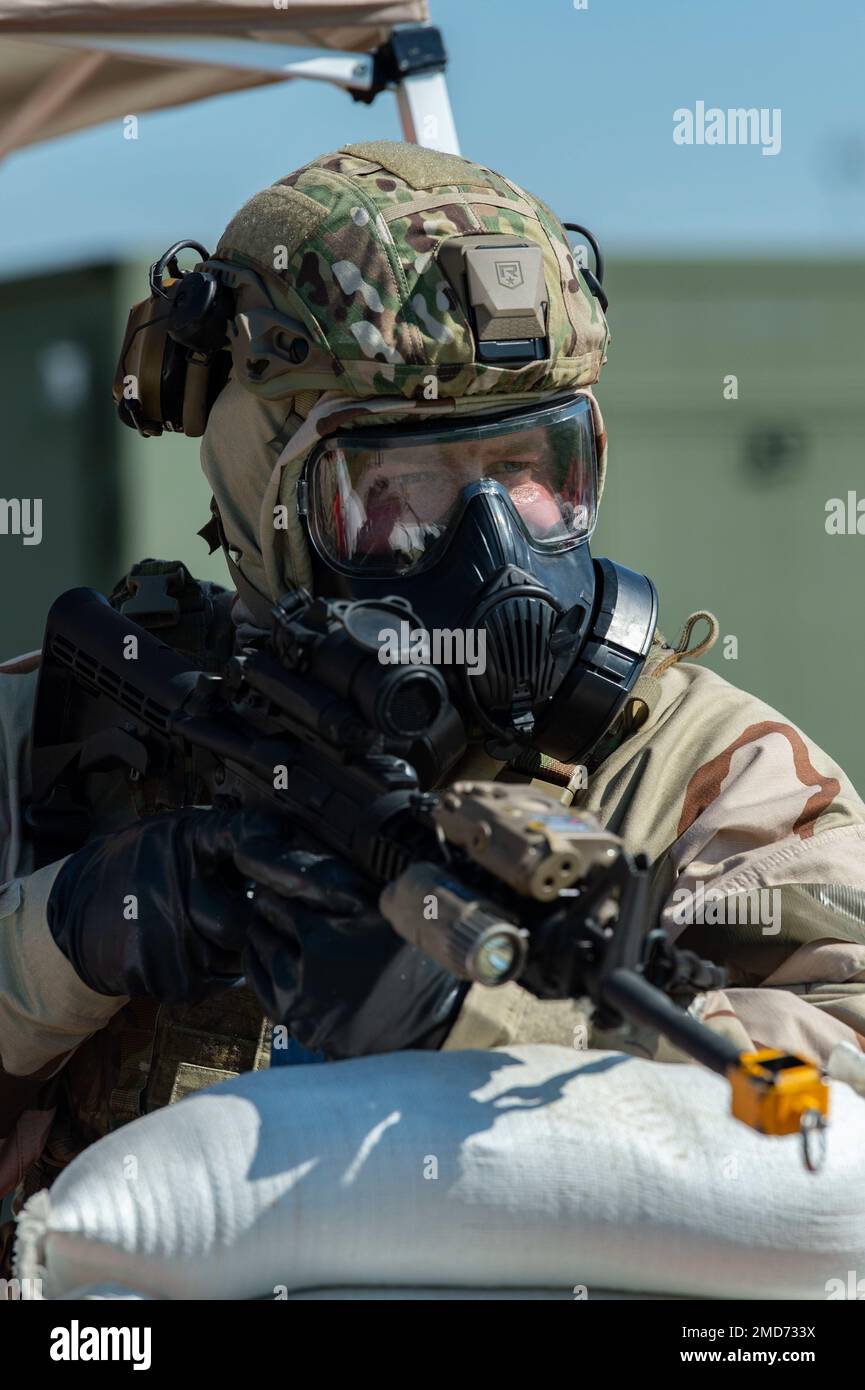 A Team Dover member wearing training protective gear stands guard ...