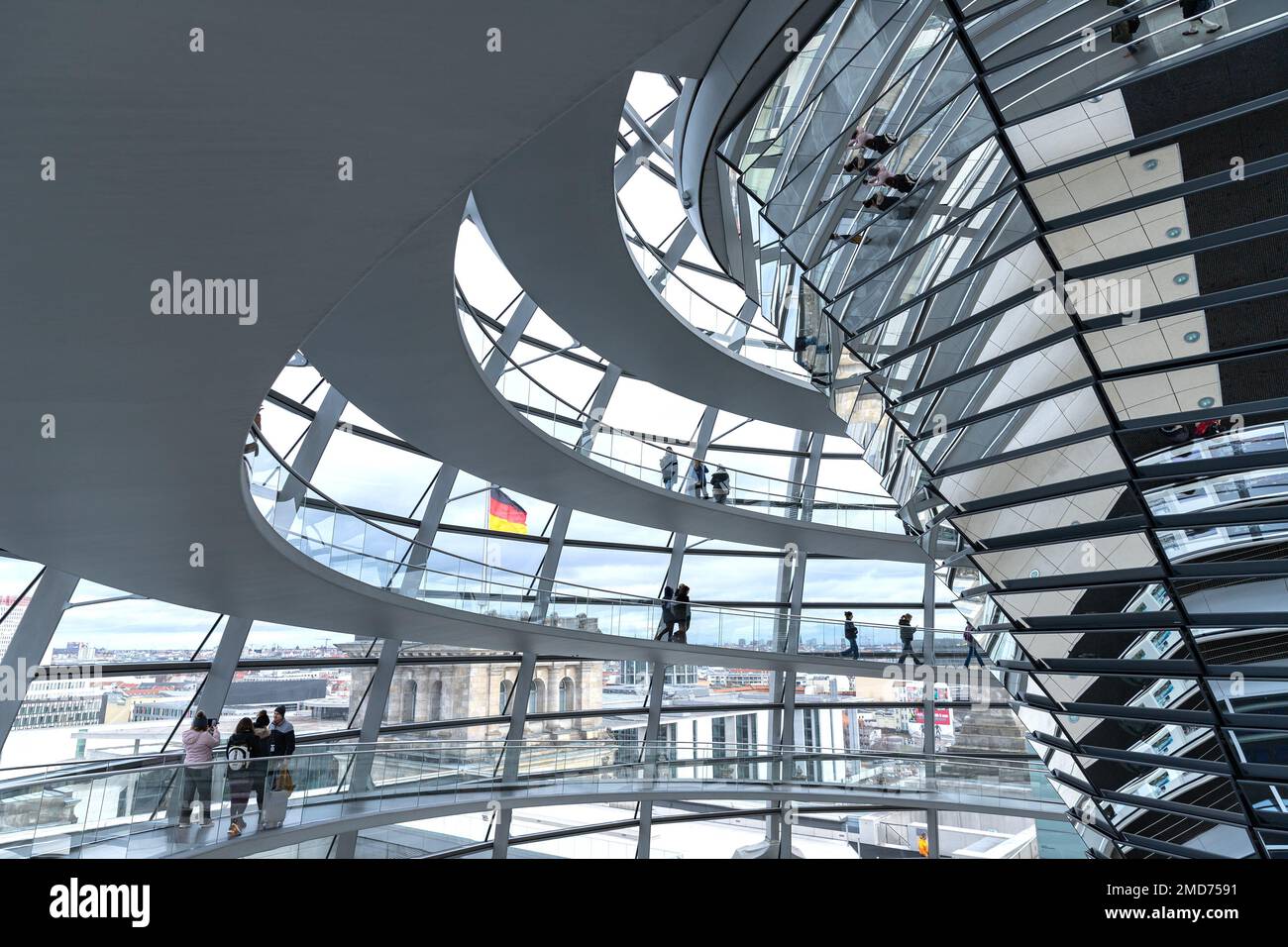 Inside the Bundestag dome. Tourists visit the parliament building of ...