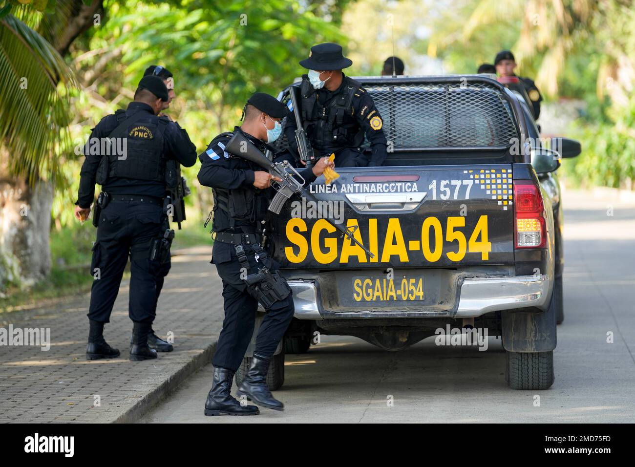 Police patrol El Estor in at the northern coastal province of Izabal ...
