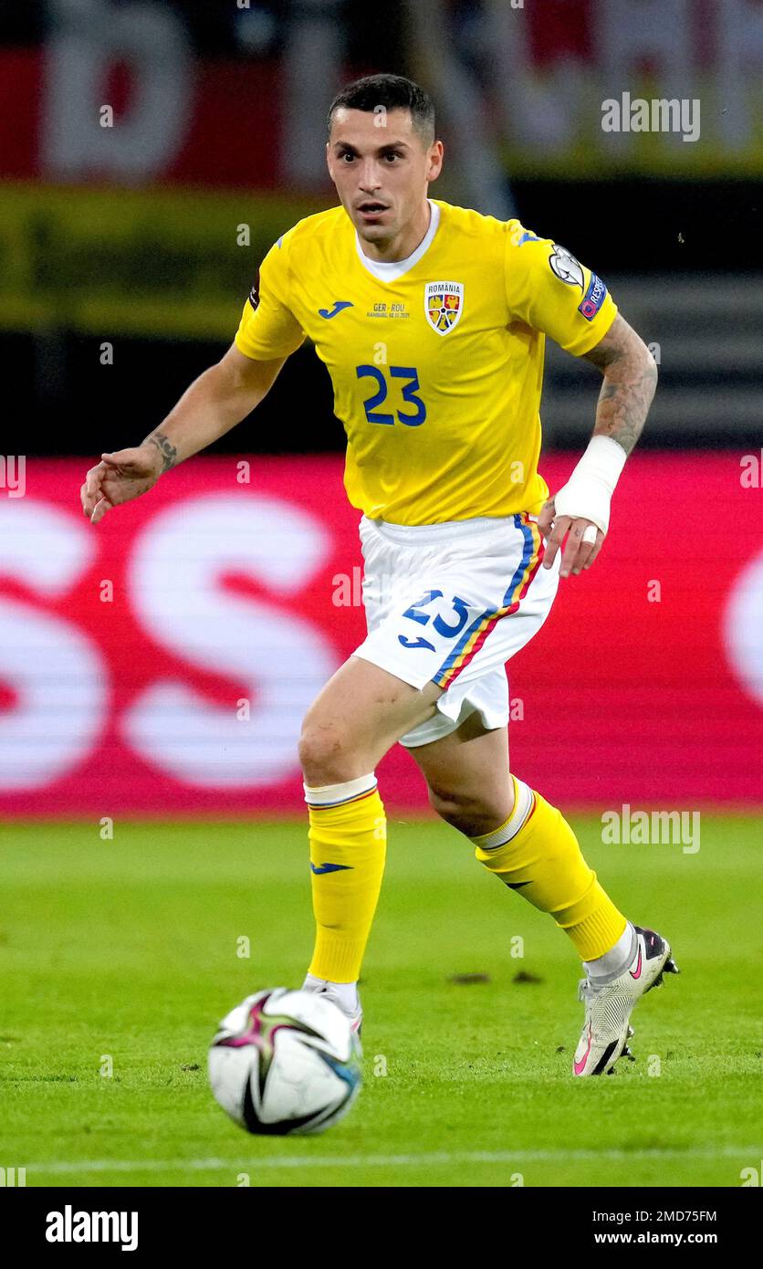Romania's Nicolae Stanciu plays the ball during the World Cup 2022 ...