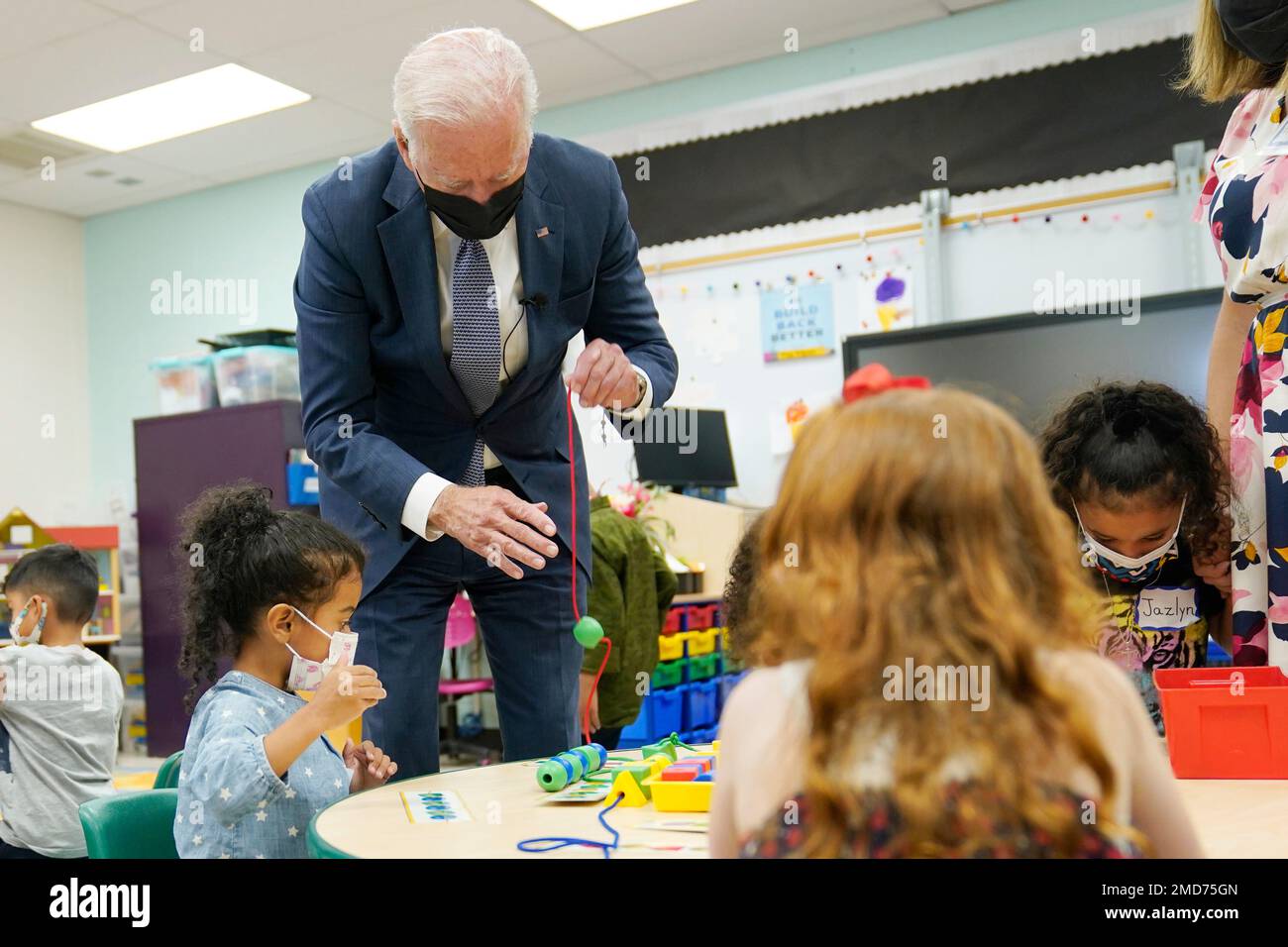 President Joe Biden talks to students during a visit to East End ...