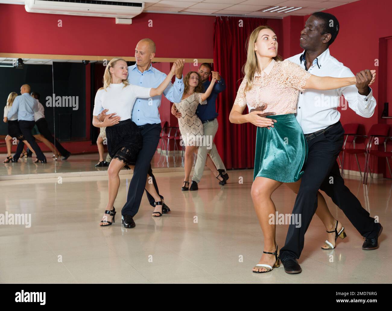 Couples enjoying latin dances Stock Photo - Alamy