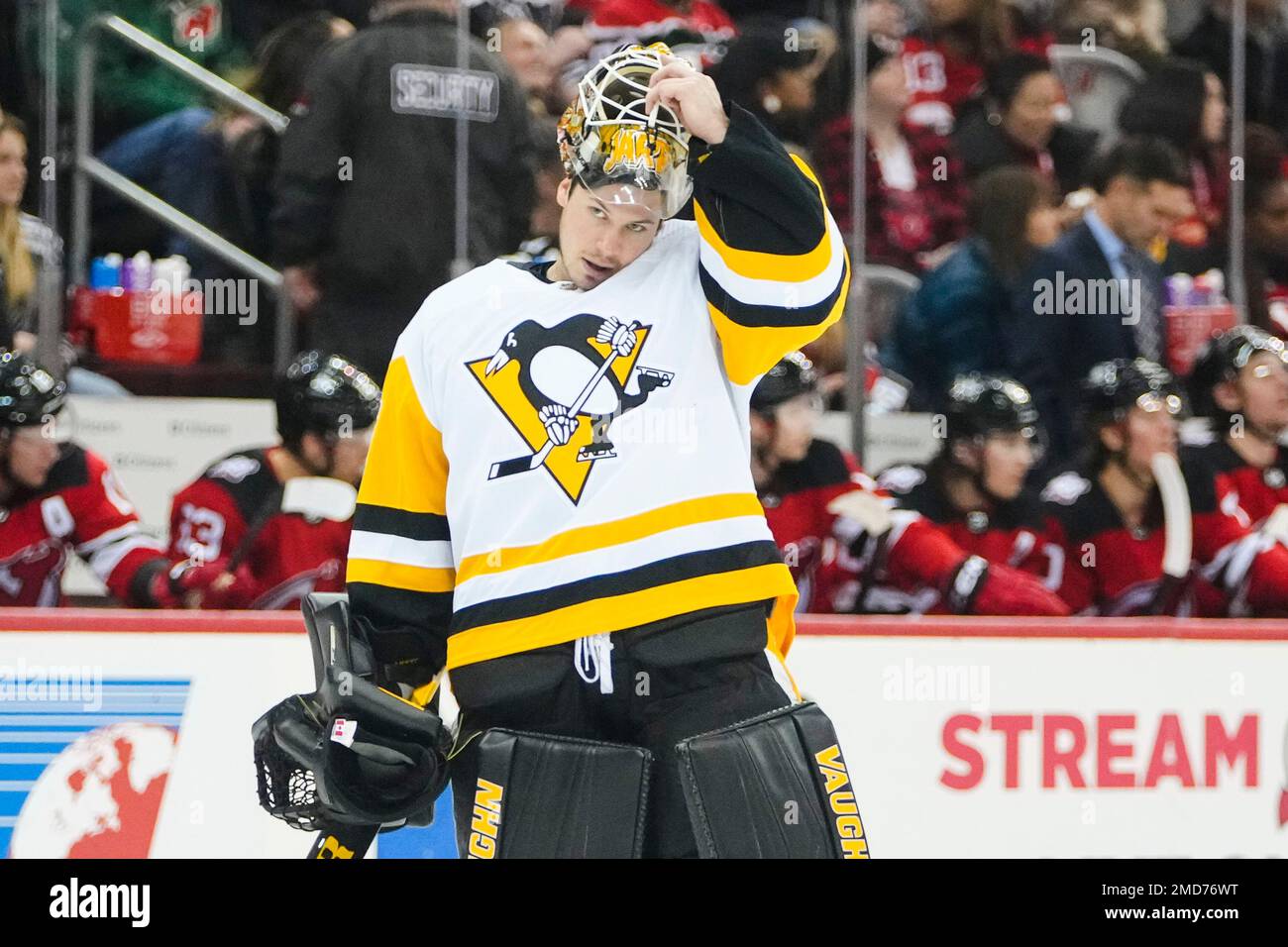 Pittsburgh Penguins goaltender Tristan Jarry adjusts his helmet during ...