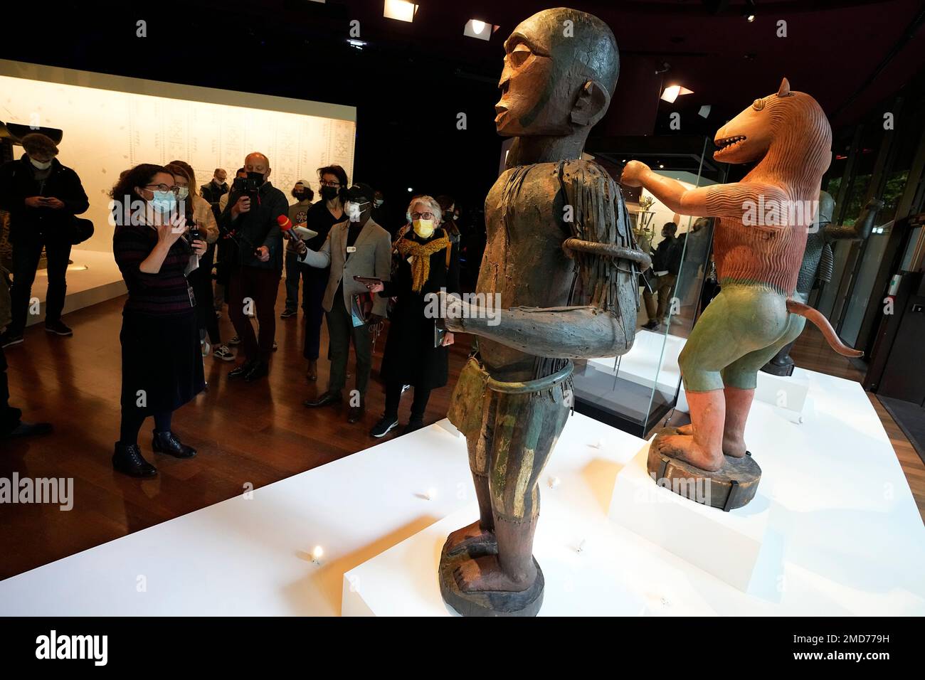 The royal statues of a half-man half-bird, left, of King Ghezo, and ...
