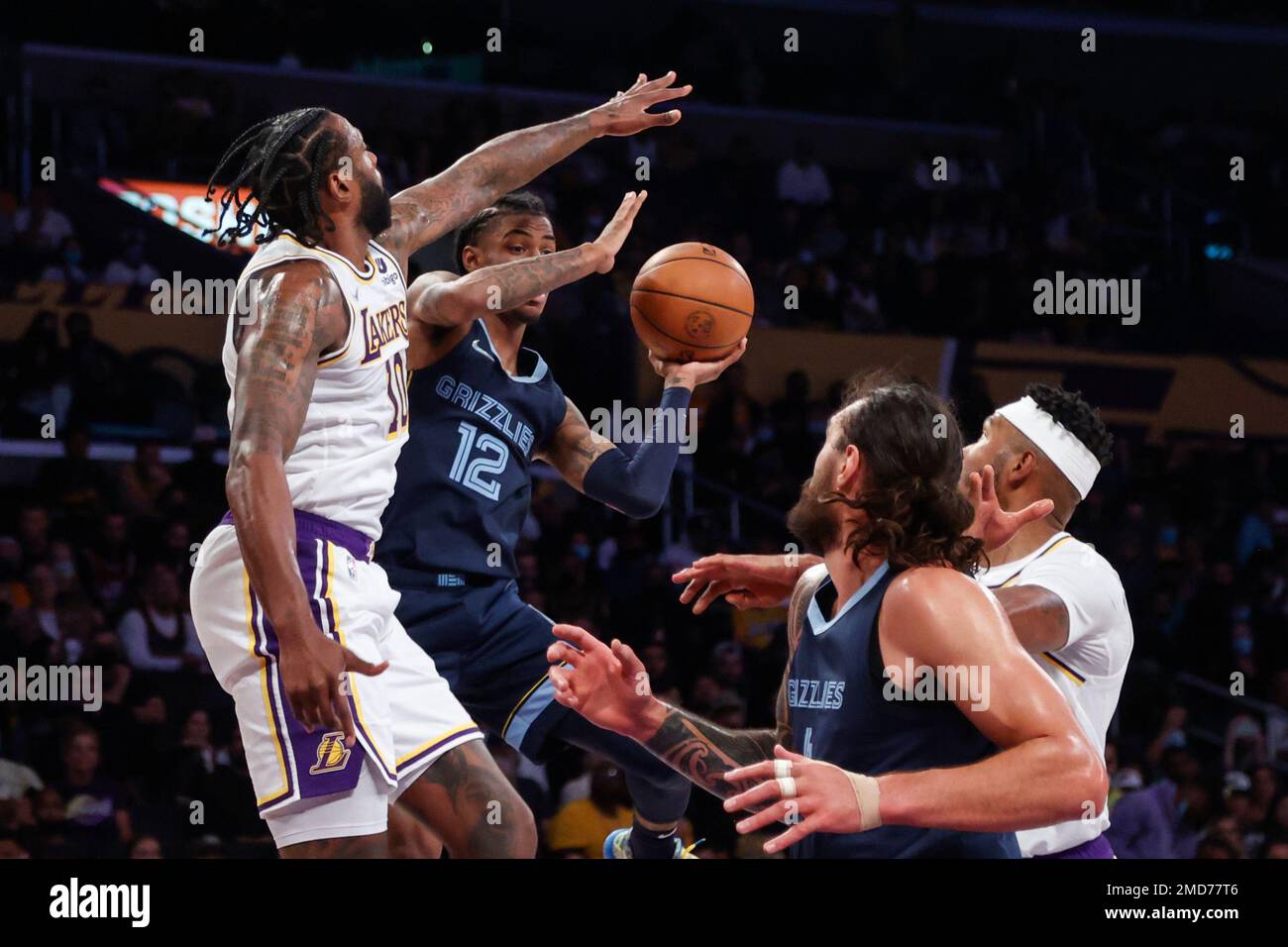 Memphis Grizzlies guard Ja Morant (12) looks to pass while defended by ...