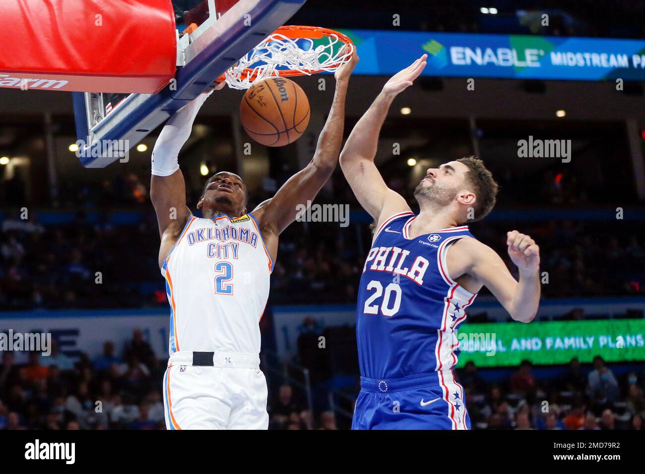 Oklahoma City Thunder guard Shai Gilgeous-Alexander (2) dunks next to ...