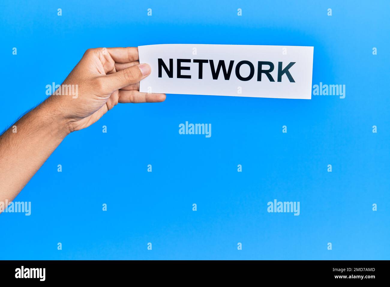 Hand of caucasian man holding paper with network word over isolated ...