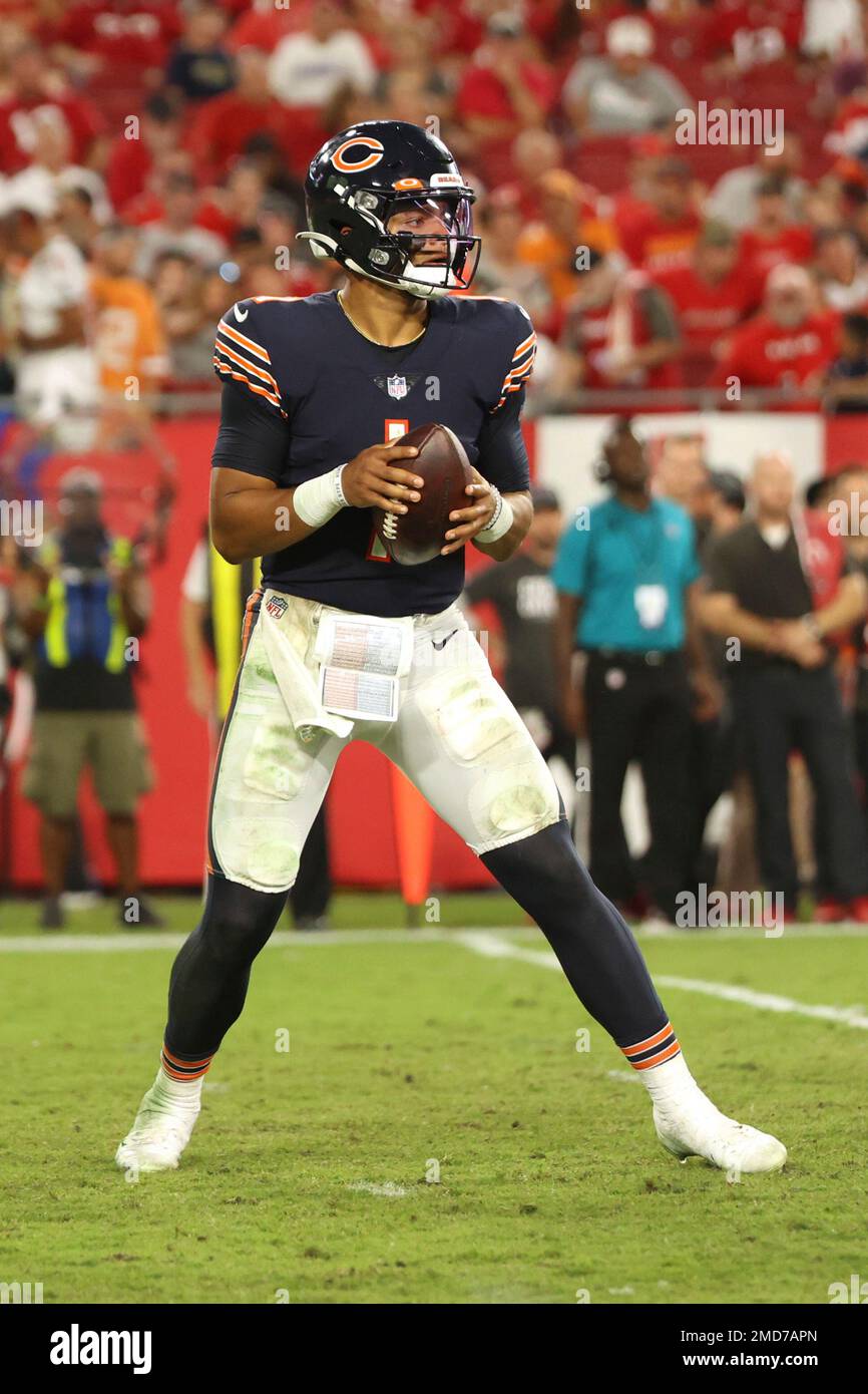 Chicago Bears quarterback Justin Fields (1) drops back for a passan NFL ...