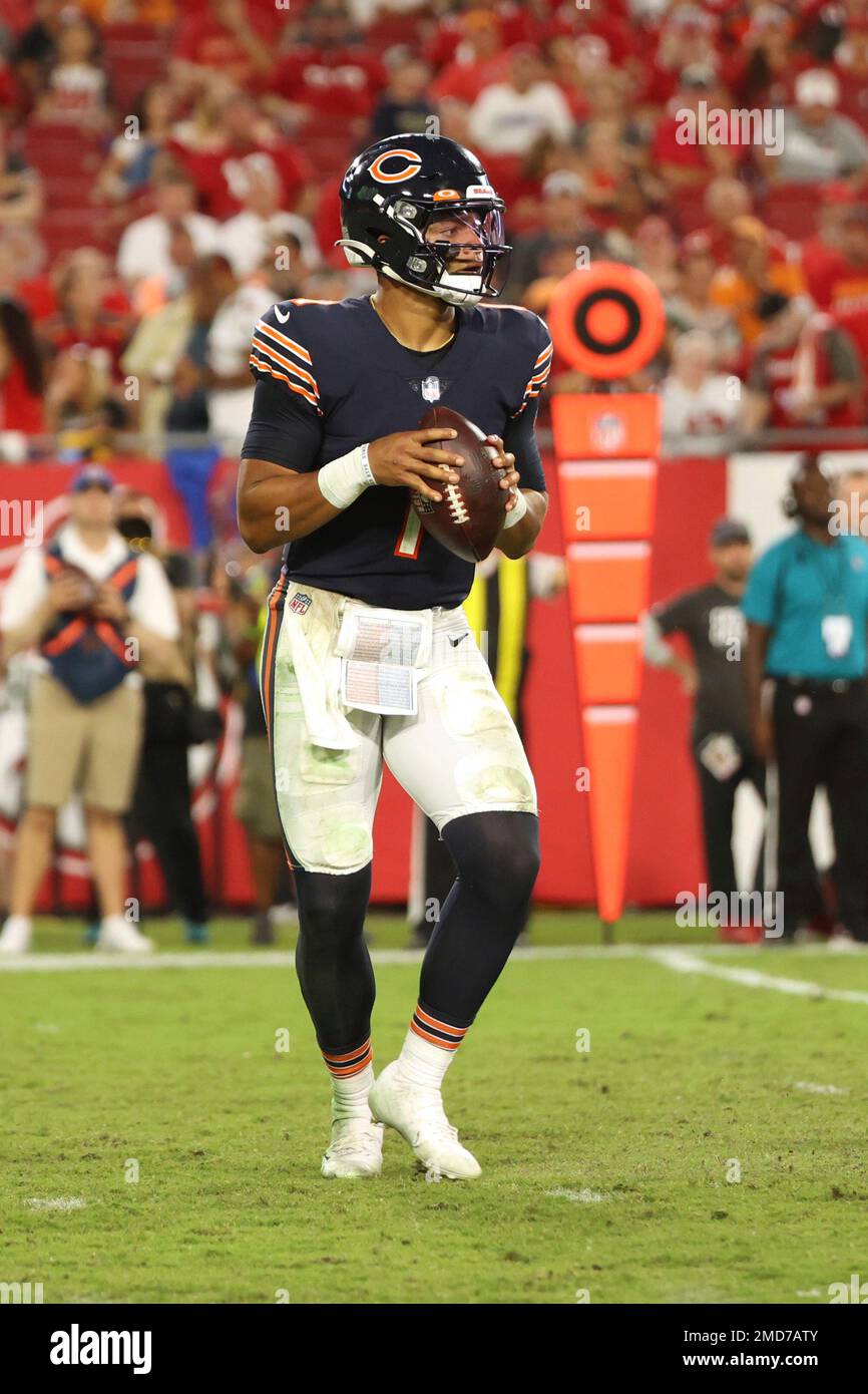 Chicago Bears quarterback Justin Fields (1) drops back for a pass ...
