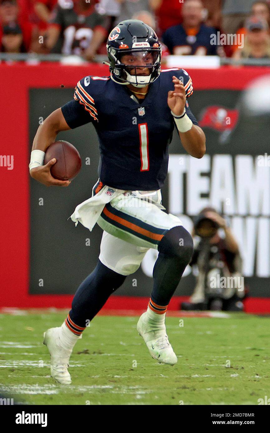 Chicago Bears quarterback Justin Fields (1) runs the ball during an NFL ...