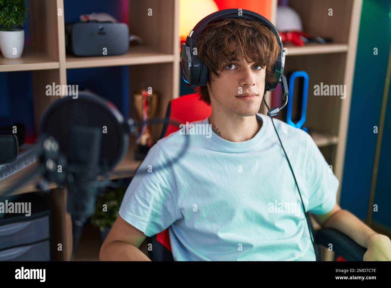 Young blond man playing video game using computer at gaming room Stock ...