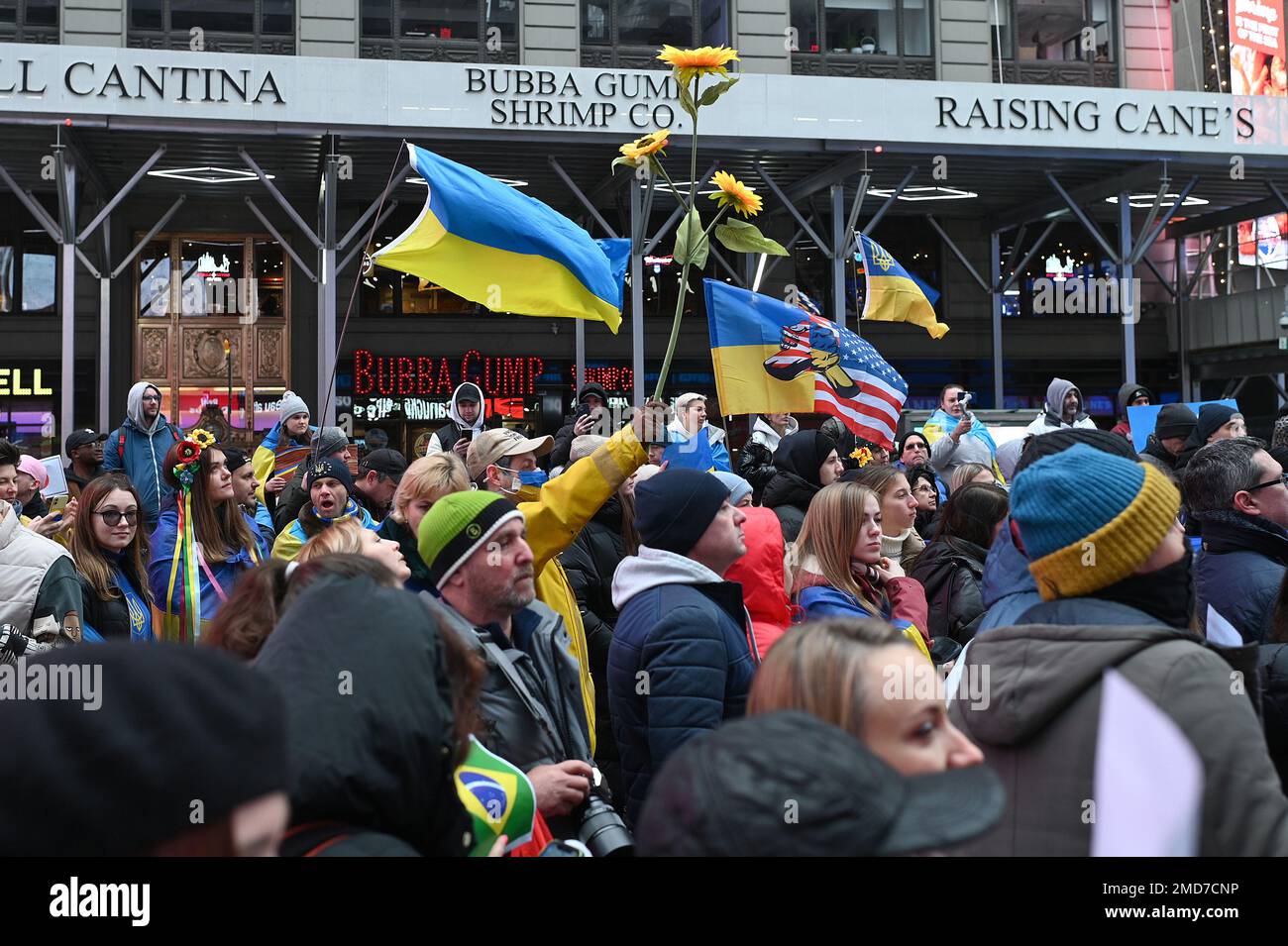 People attend a rally in Times Square to protest the ongoing war in ...