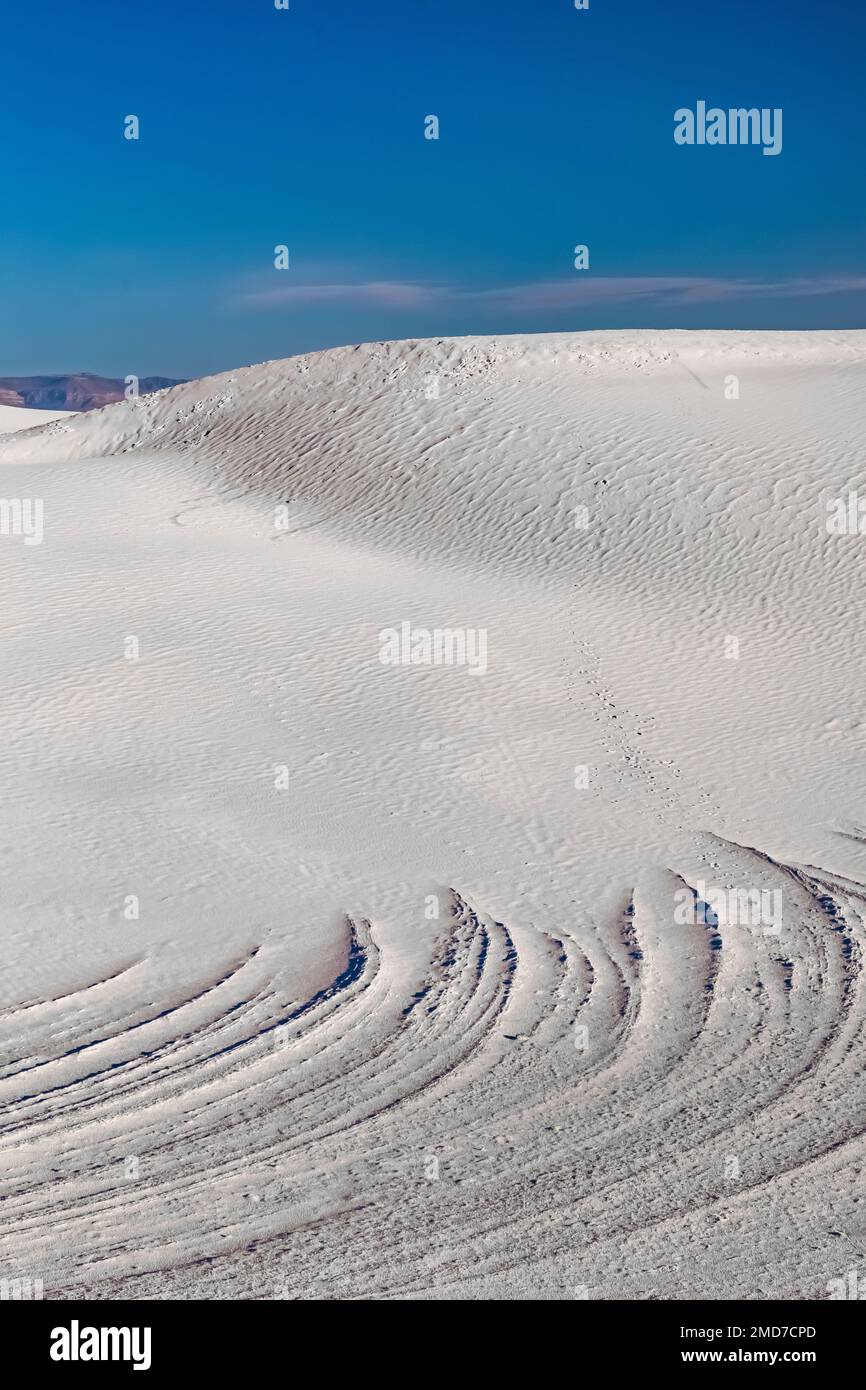 Hard ridges of sand between blowing dunes in the gypsum dunes of White ...