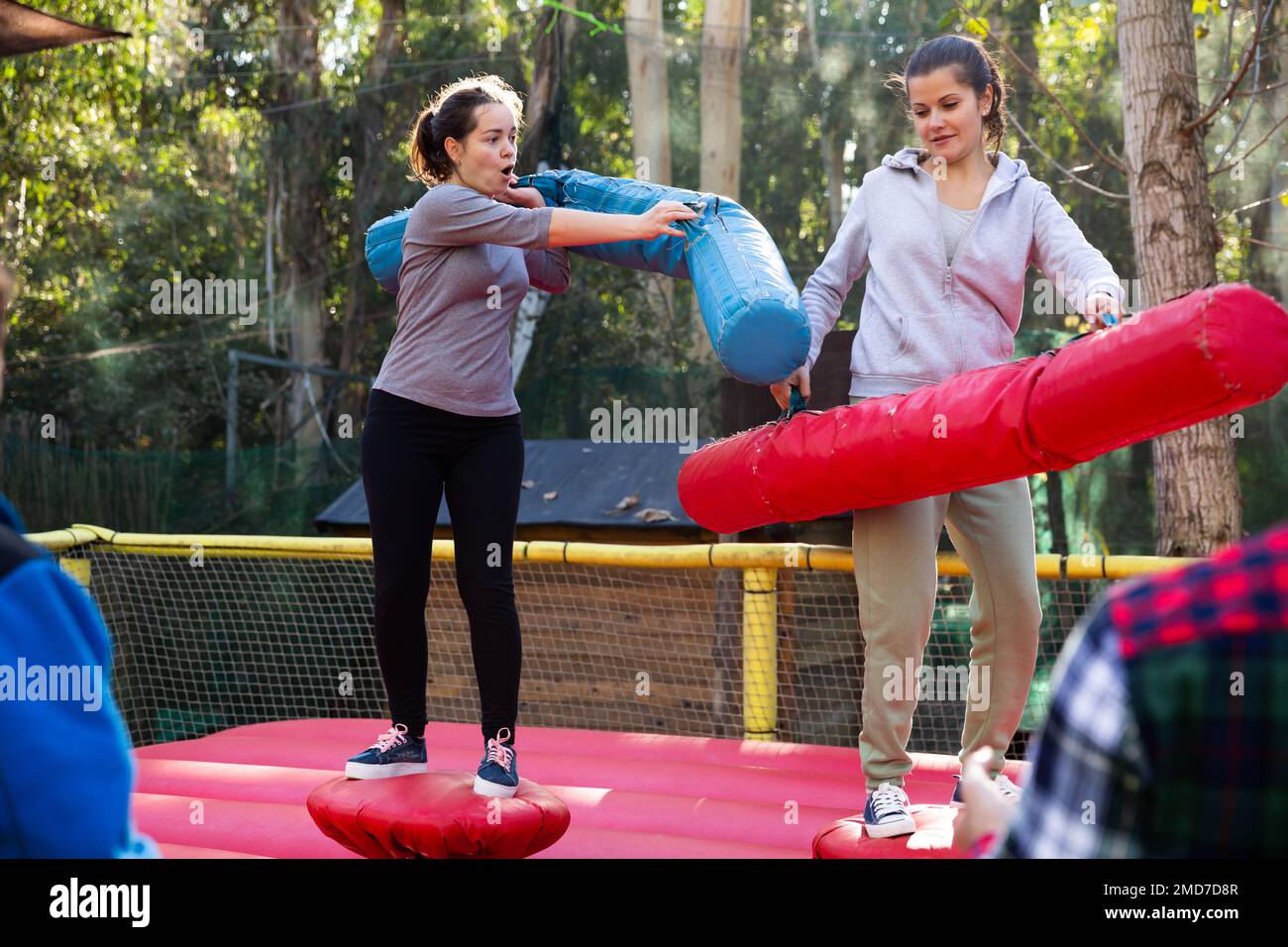 Female friends fighting by big stuffed beams Stock Photo - Alamy