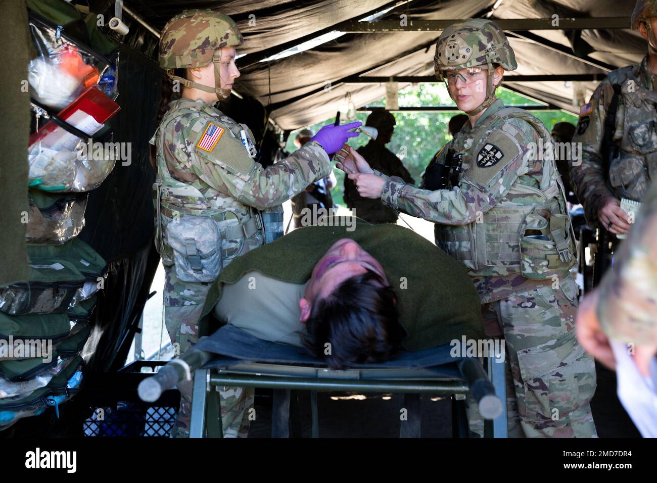 U.S. Army Spc. Quincee Schultz, left, a combat medic in training ...