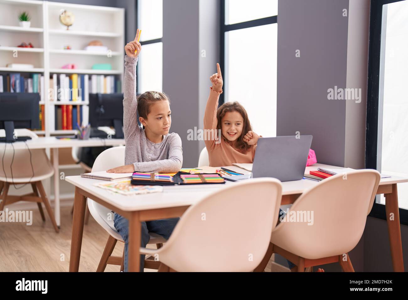 Two kids students using computer having online lesson at classroom ...