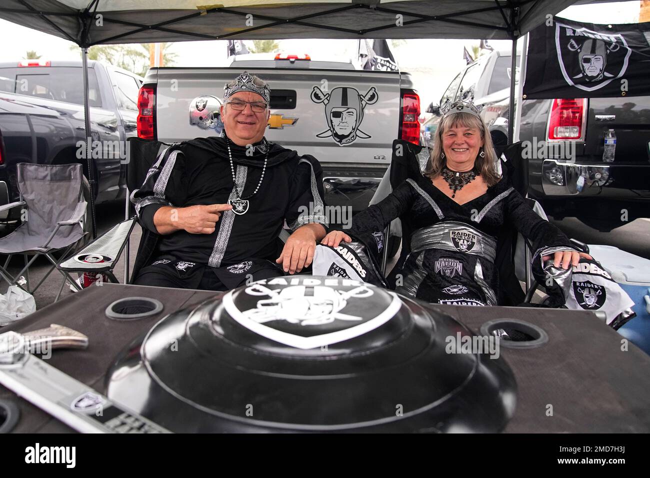 Tom and Petra Thiessen pose while tailgating before an NFL football ...