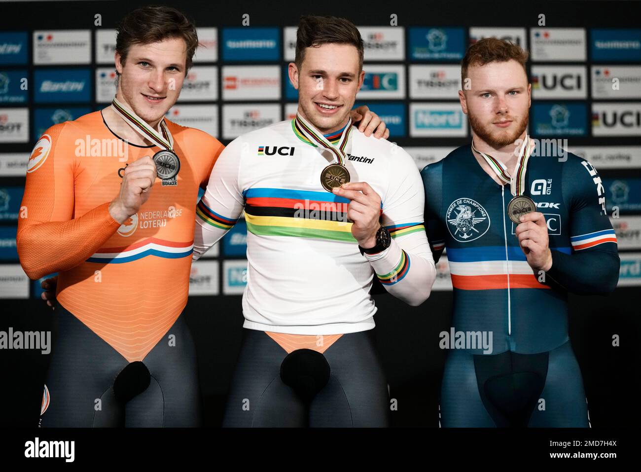 Harrie Lavreysen of Netherlands, center, poses with the gold medal ...