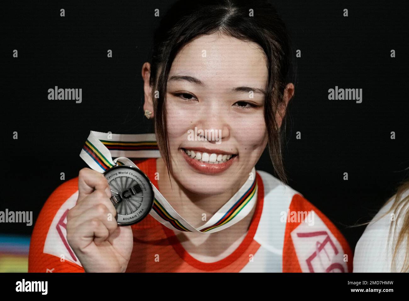 Mina Sato of Japan shows her silver medal in the Women's Keiring Finals ...