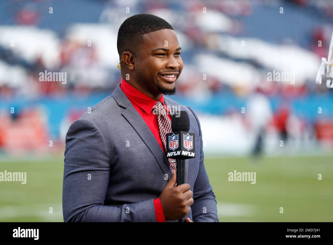 NFL Network reporter Cameron Wolfe works before an NFL football game ...