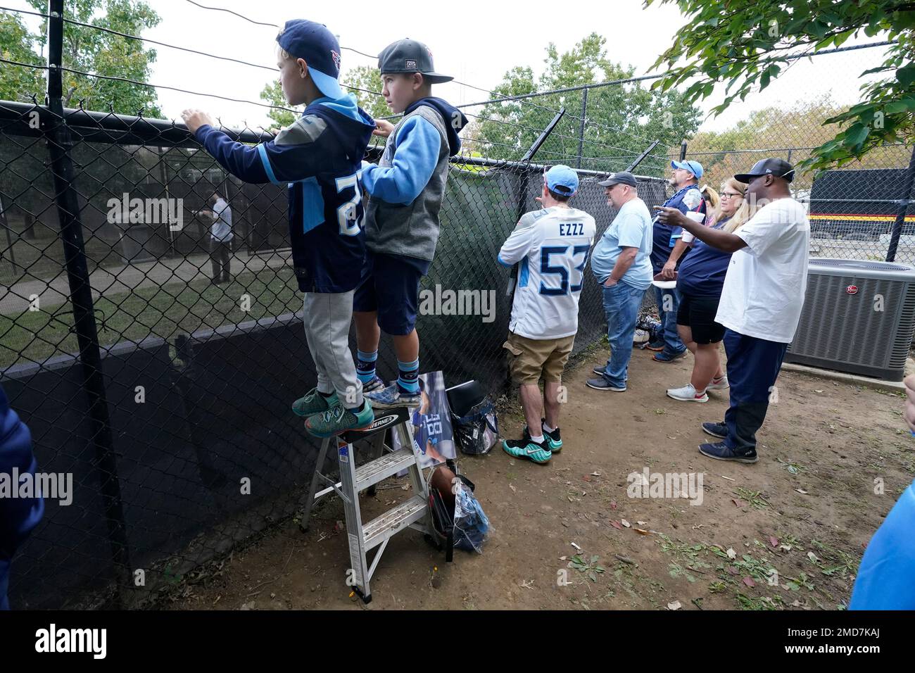 Quinn Keefer, 9, left, of Denver, shares a ladder with Jesse Winger, 14 ...