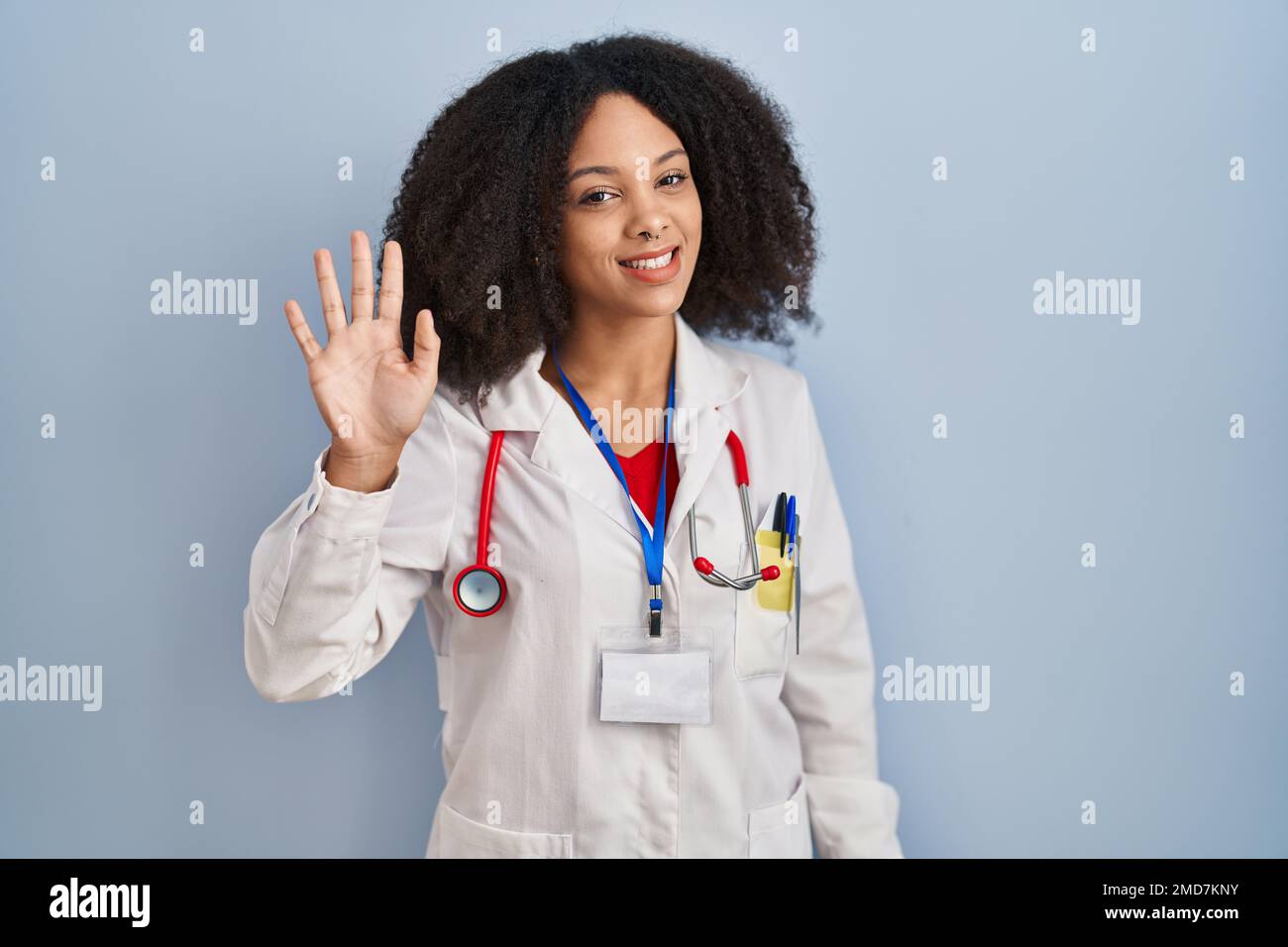 Young african american woman wearing doctor uniform and stethoscope ...