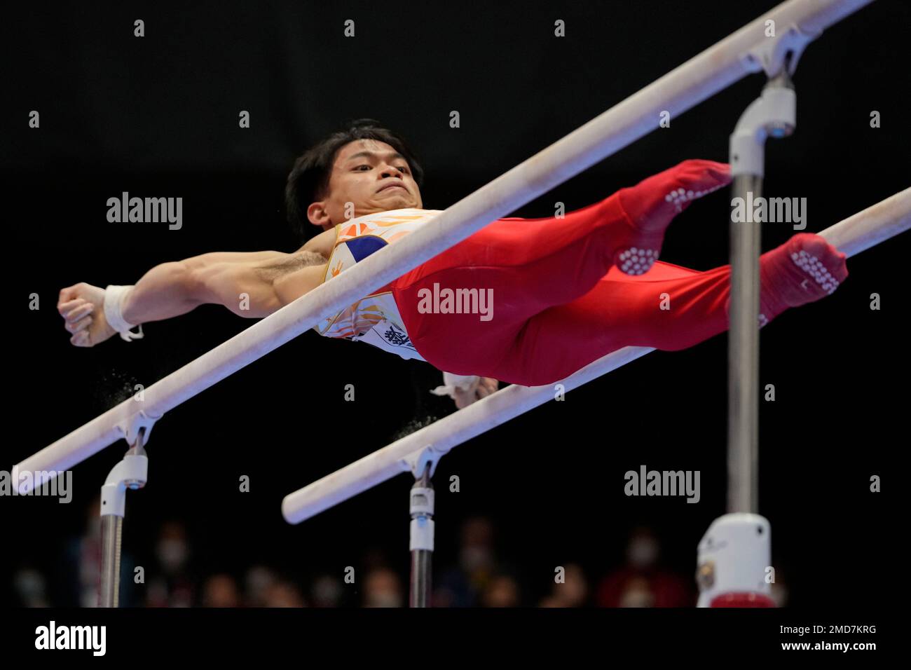 Carlos Edriel Yulo, of the Philippines, competes in the parallel bars ...