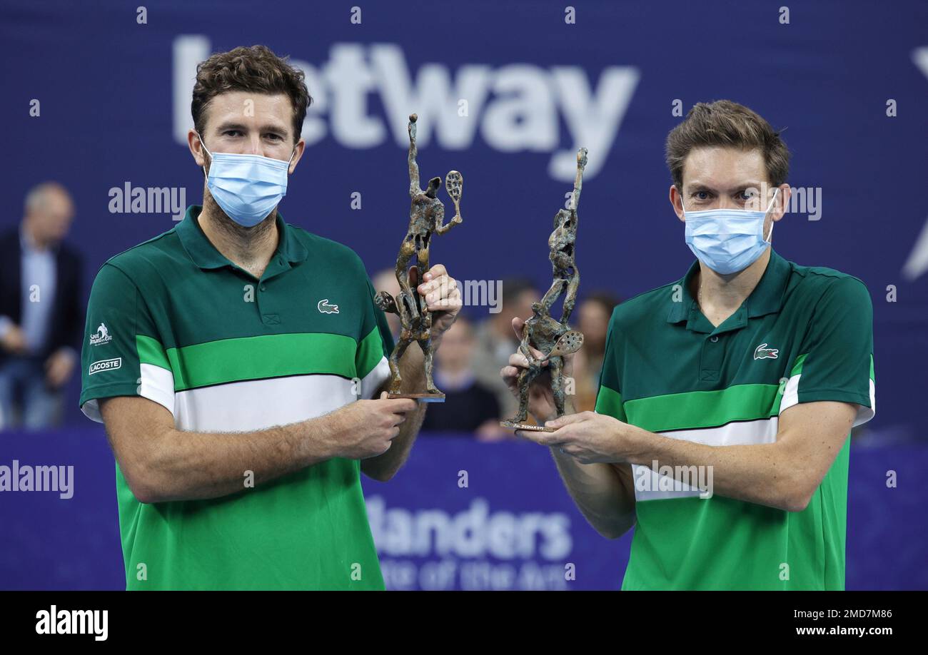 First place, France's Nicolas Mahut and Fabrice Martin pose with their ...