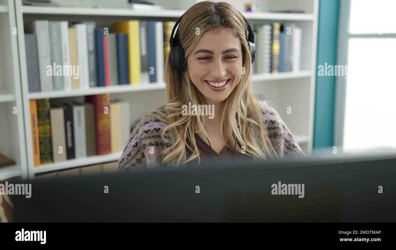 Young blonde woman student smiling confident having video call at ...