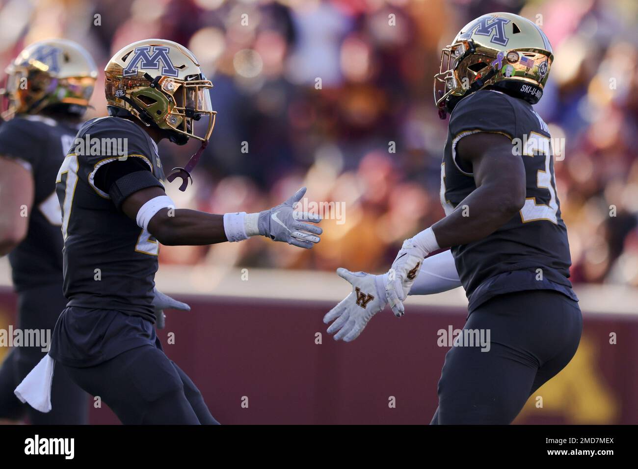 Minnesota defensive back Tyler Nubin (27) high fives Minnesota ...