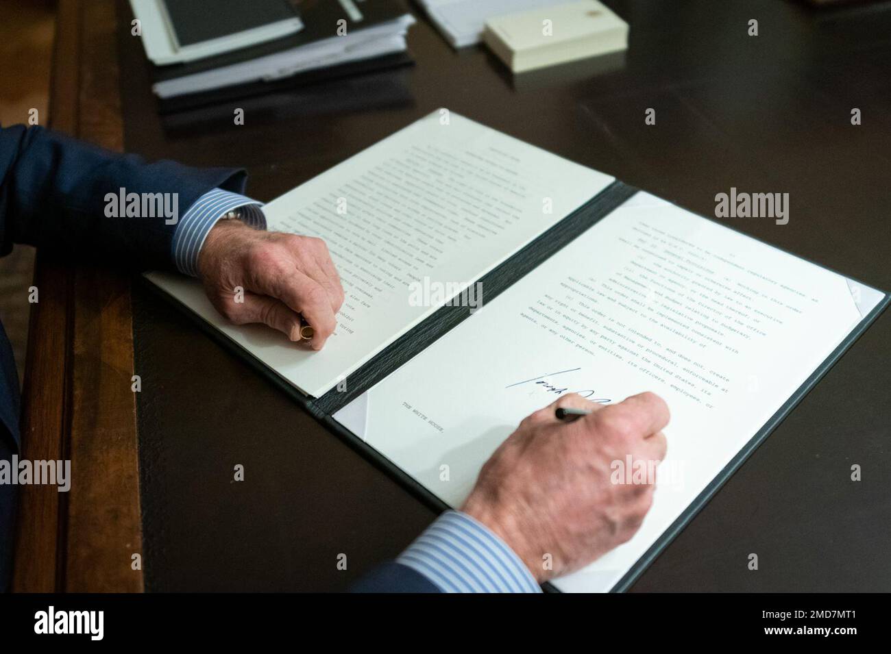 Reportage: President Joe Biden signs an executive order on promoting ...