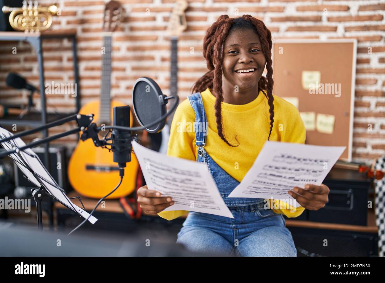 African american woman musician smiling confident singing song at music ...