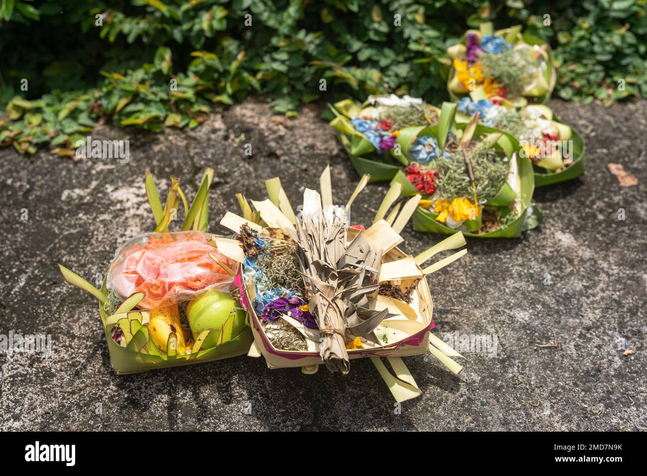 Side view of Balinese offerings on stone surface, horizontal Stock ...