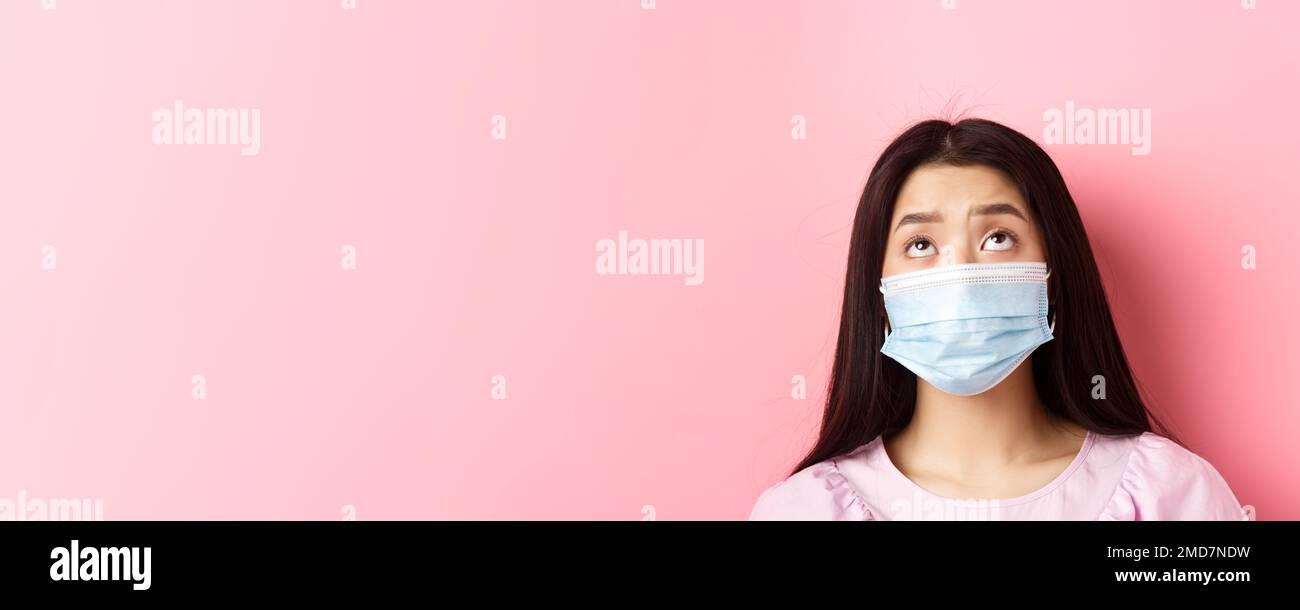Covid-19, pandemic and quarantine concept. Close-up of sad asian woman ...
