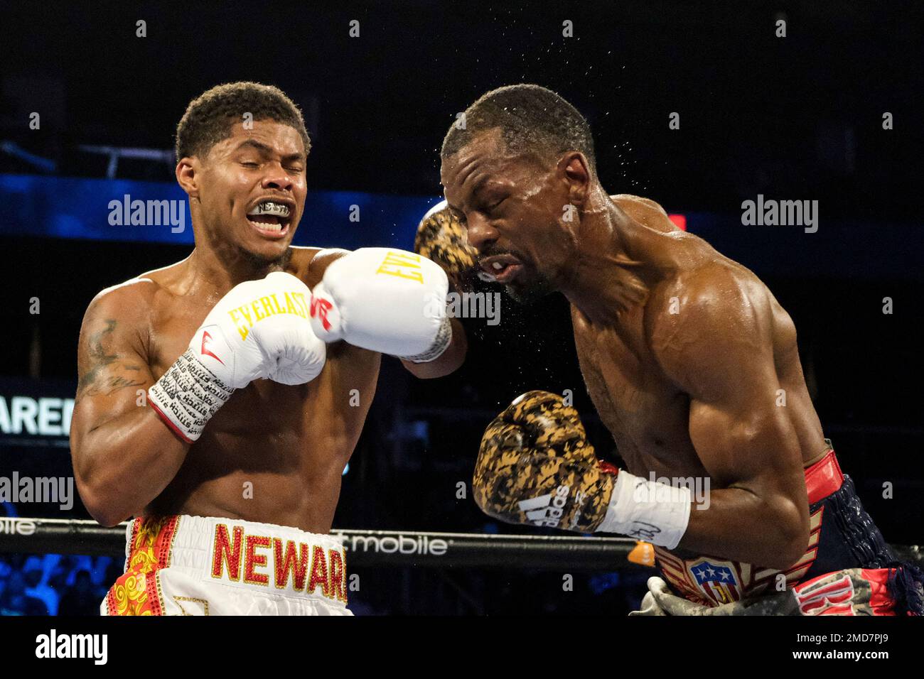 Shakur Stevenson, left, lands a punch to Jamel Herring during a junior ...