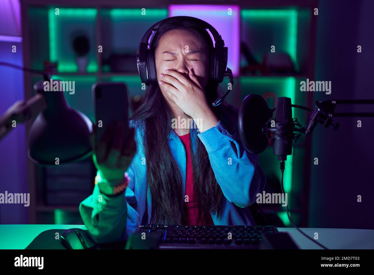 Tired female gamer playing video games hi-res stock photography and ...