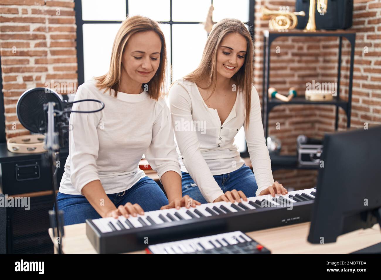 Elderly women playing acoustic hi-res stock photography and images - Alamy