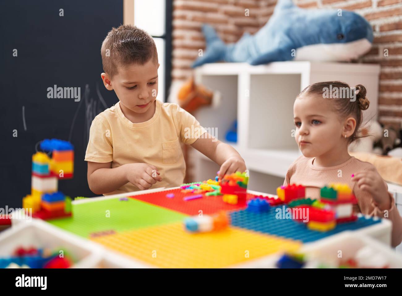 Hispanic kids playing with blocks hi-res stock photography and images ...